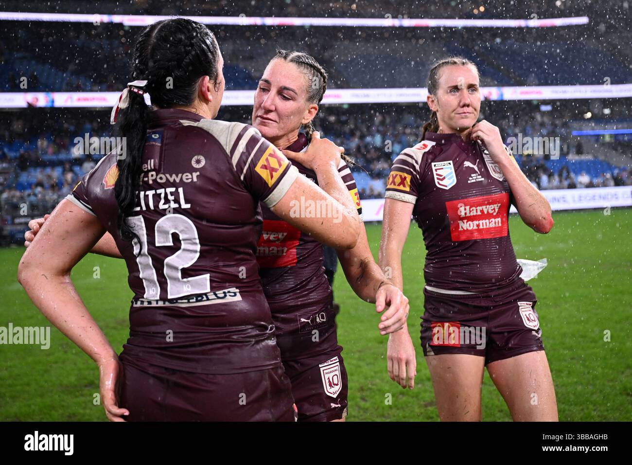 Romy Teitzel (left) Ali Brigginshaw and Tamika Upton of the Maroons ...