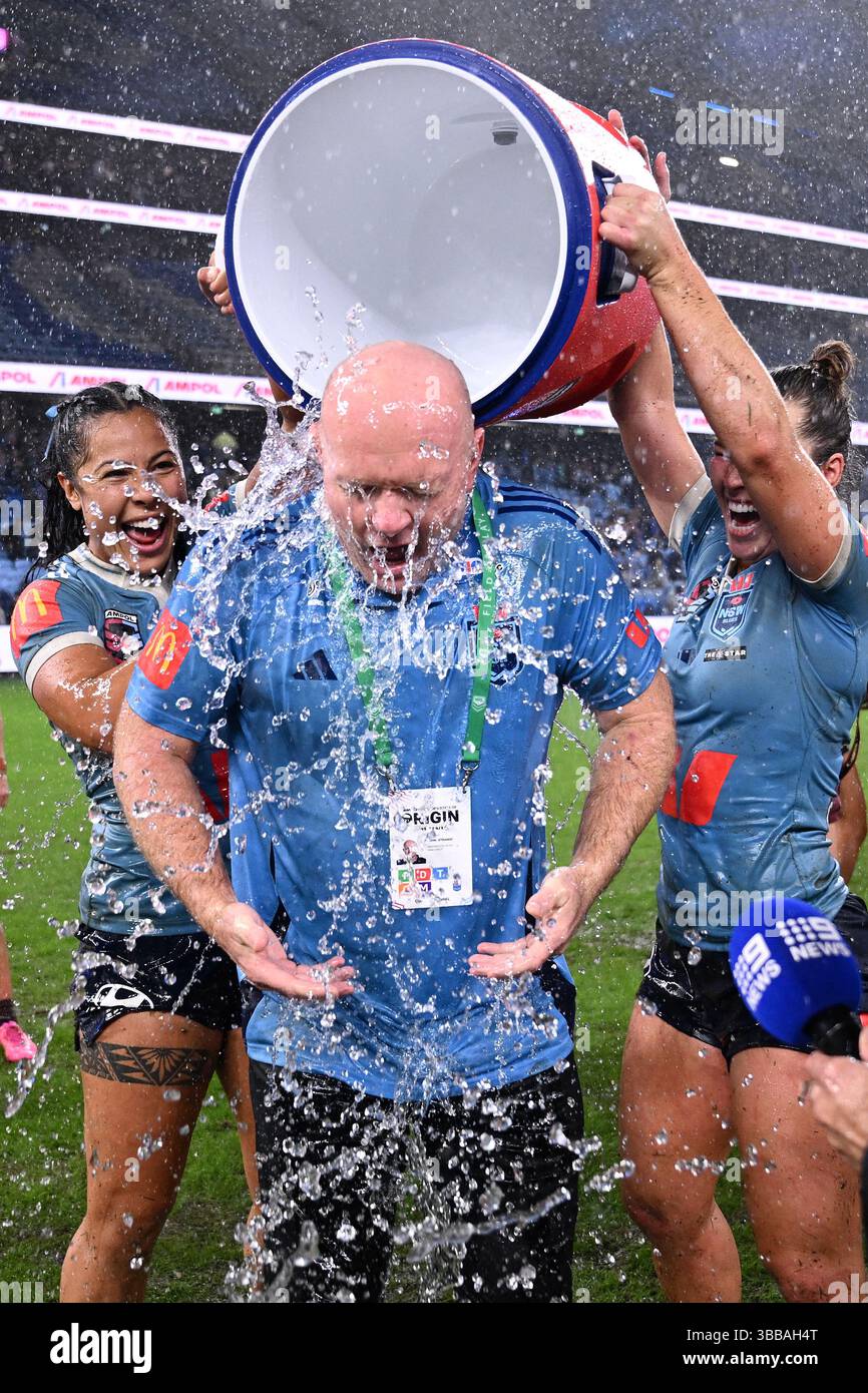 Sydney, Australia. 15th May, 2025. Blues coach John Strange gets water ...