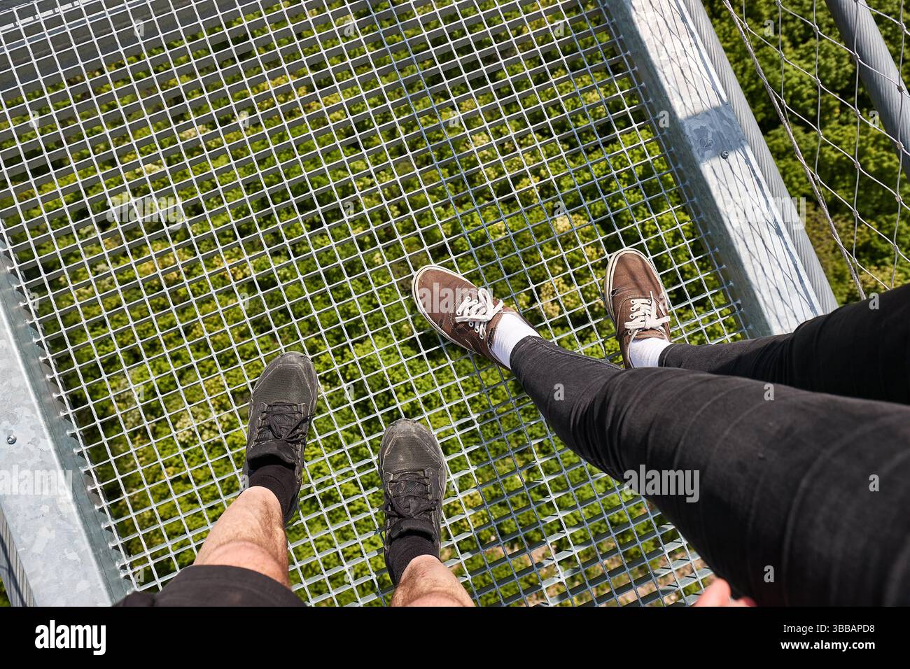Standing on suspension walk bridge, looking down Stock Photo - Alamy