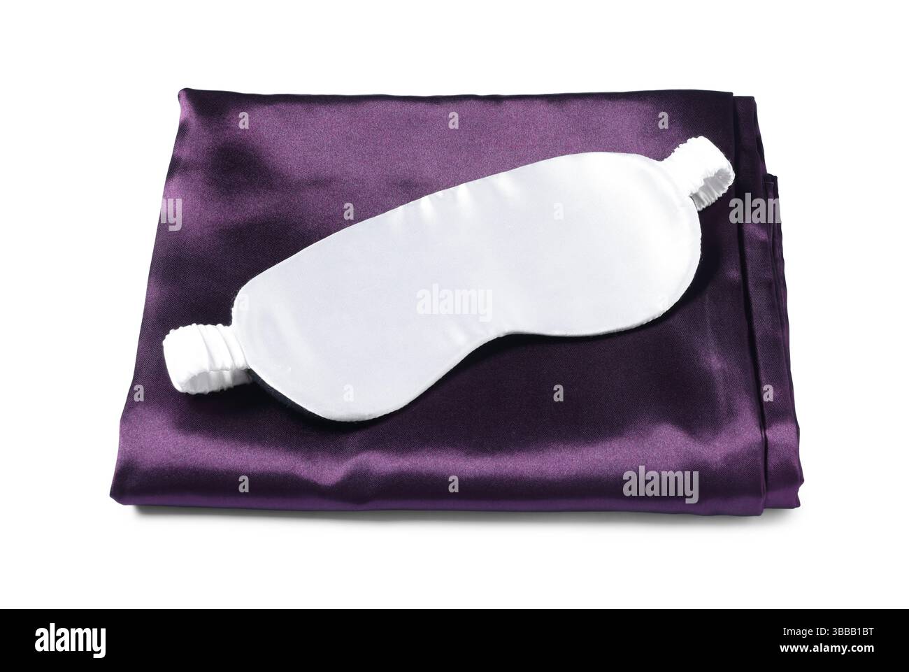 Silky bed linens and sleeping mask on white background Stock Photo - Alamy