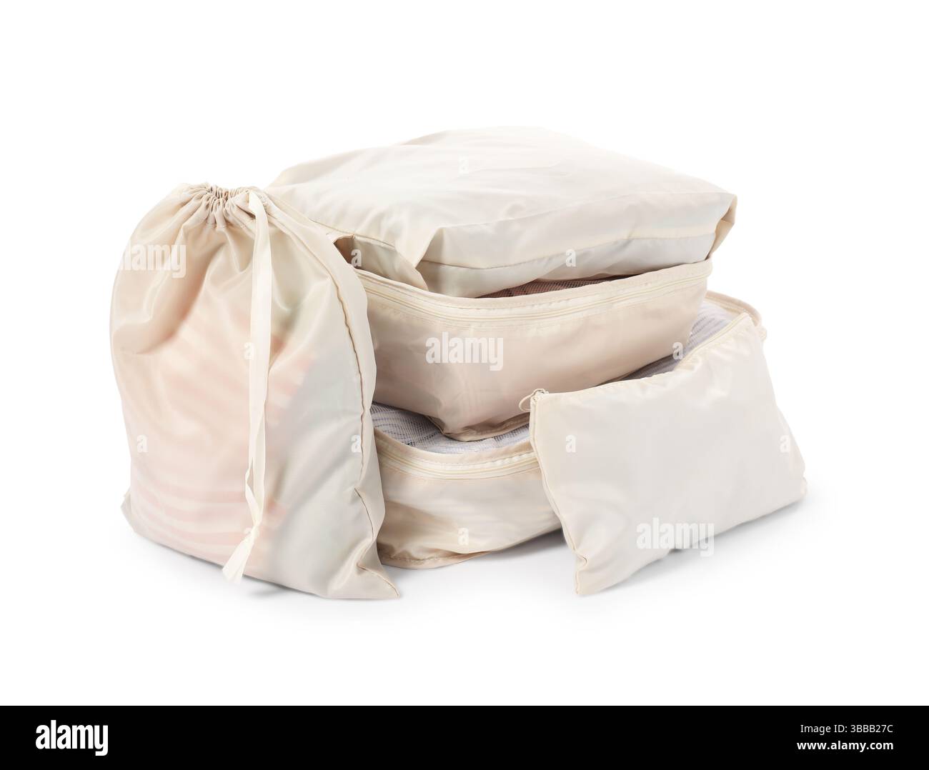 Beige packing cubes with clothes isolated on white Stock Photo - Alamy