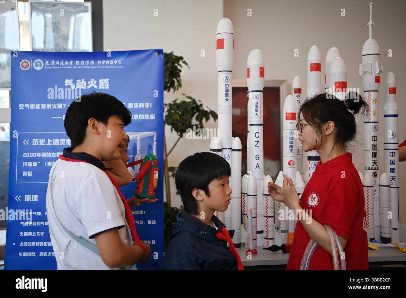 Tianjin. 15th May, 2025. Primary school students learn about rockets at ...