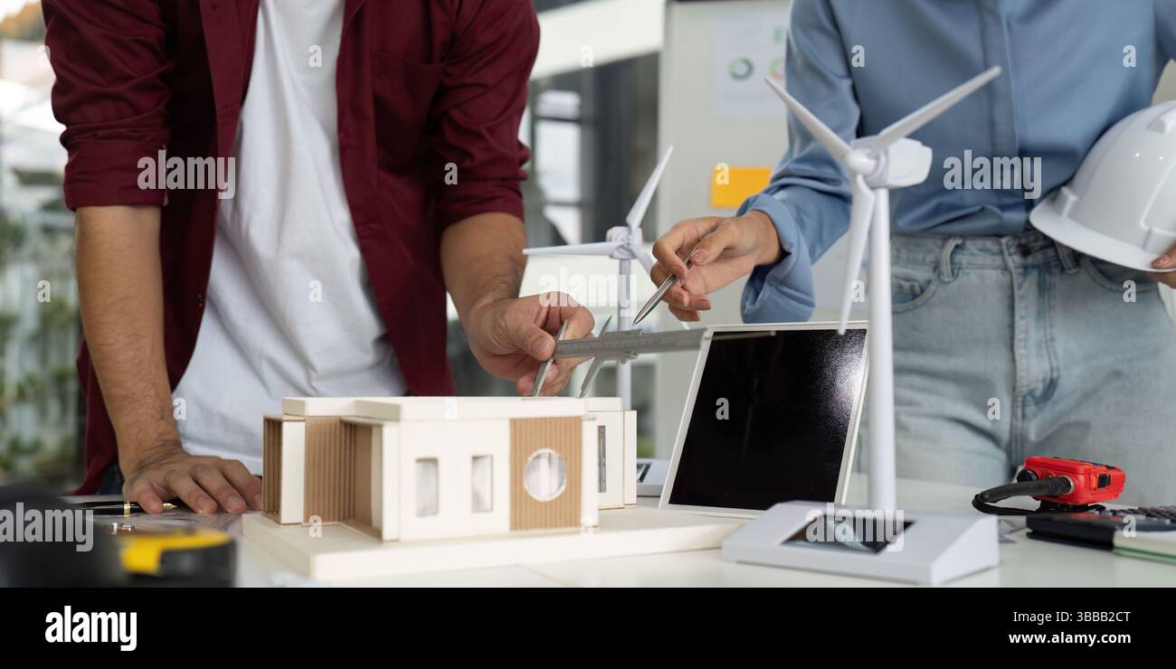 Engineer Collaboration on Sustainable Design. Team working on eco ...