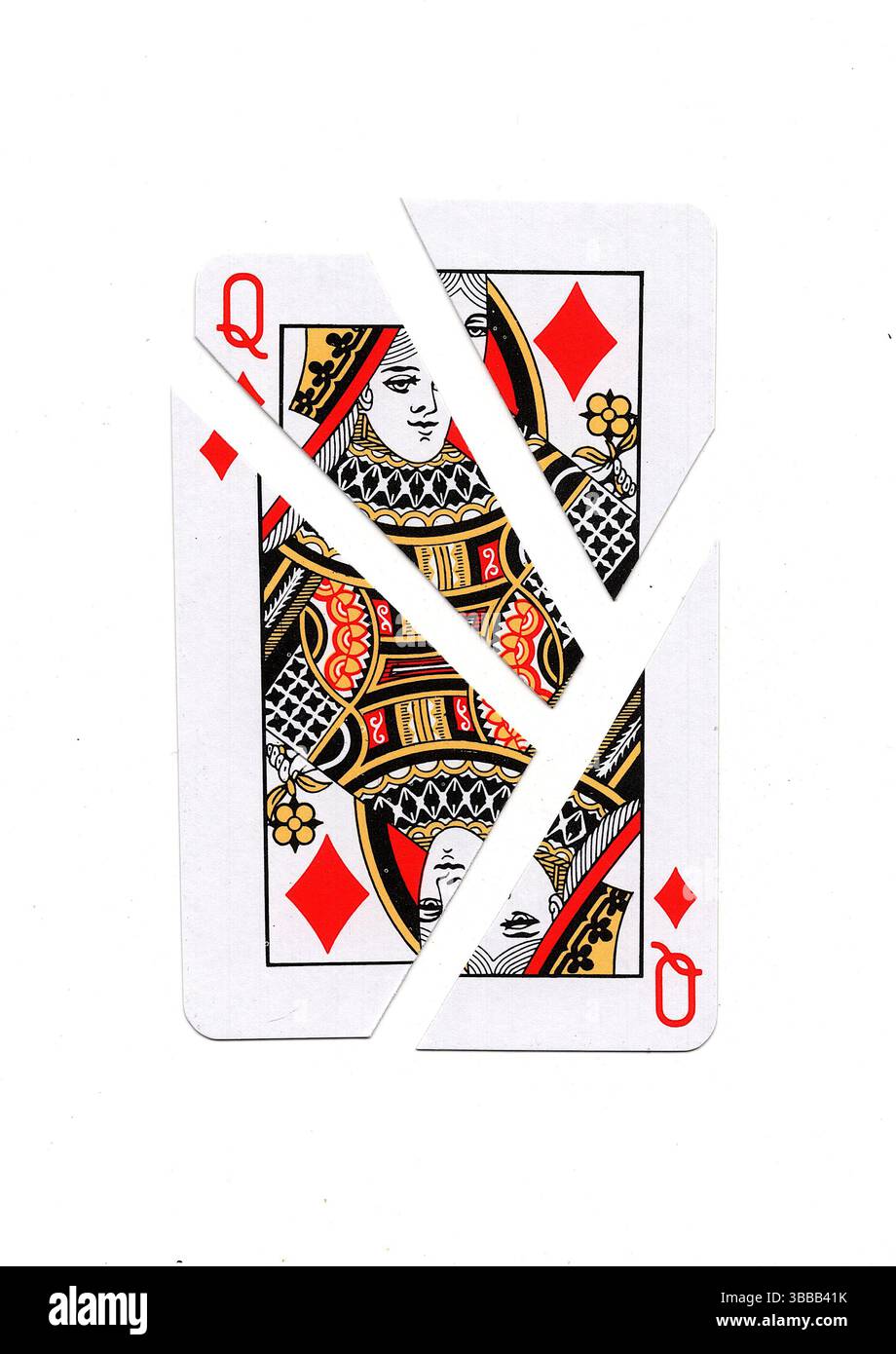 A vintage playing card cut into sharp pieces on a white background ...
