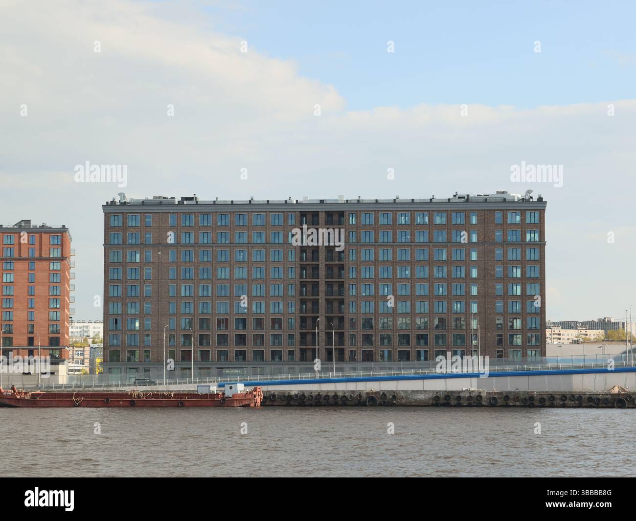 Modern Waterfront Building Showcasing a Stunning Reflective Glass ...