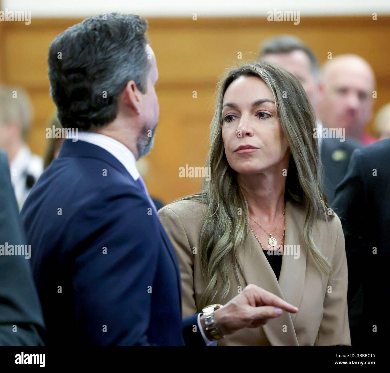 Defendant Karen Read, right, speaks to her attorney, Alan Jackson ...
