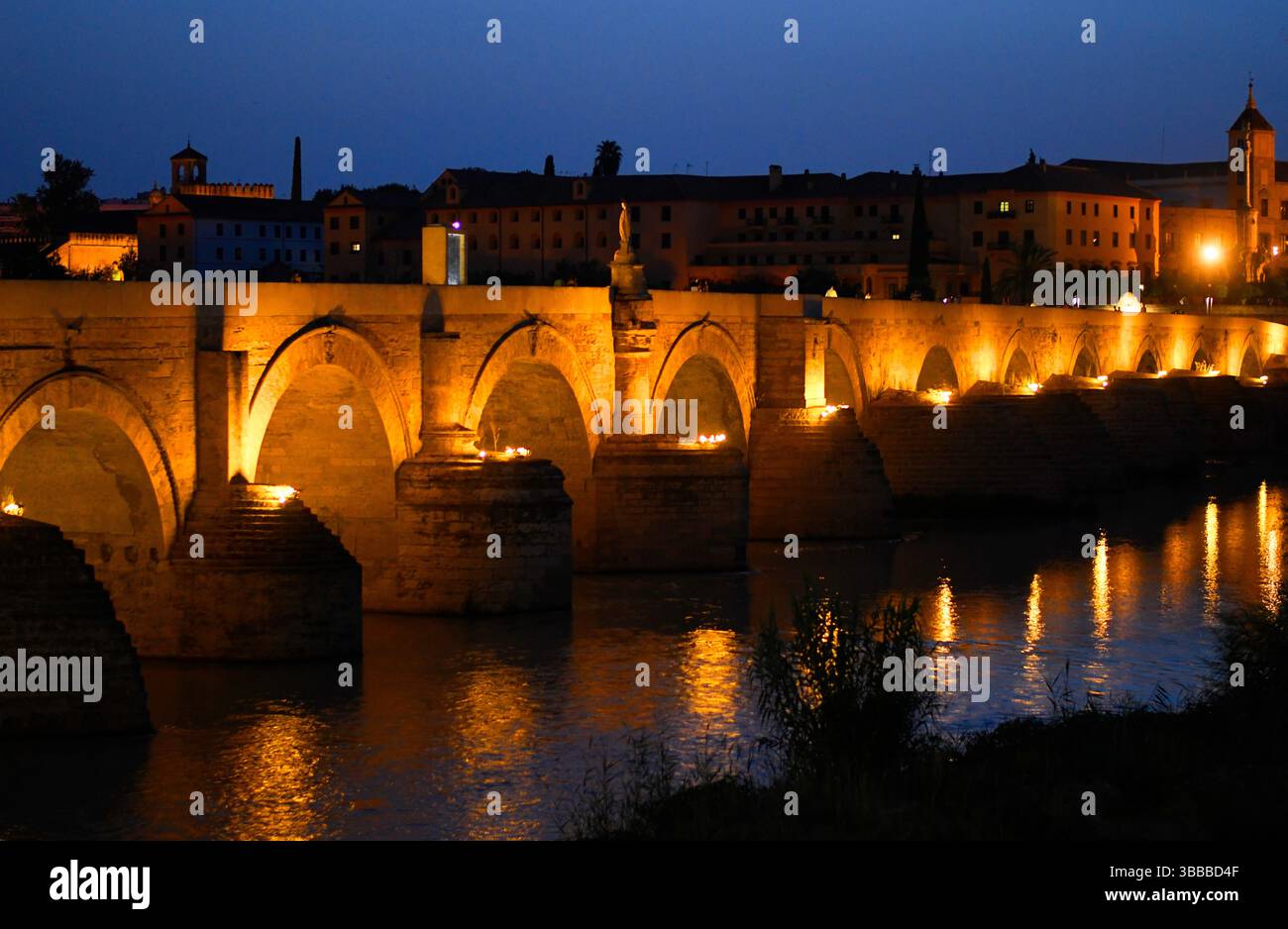 Roman bridge on Guadalquivir river by night, Cordoba, Andalusia,Spain ...
