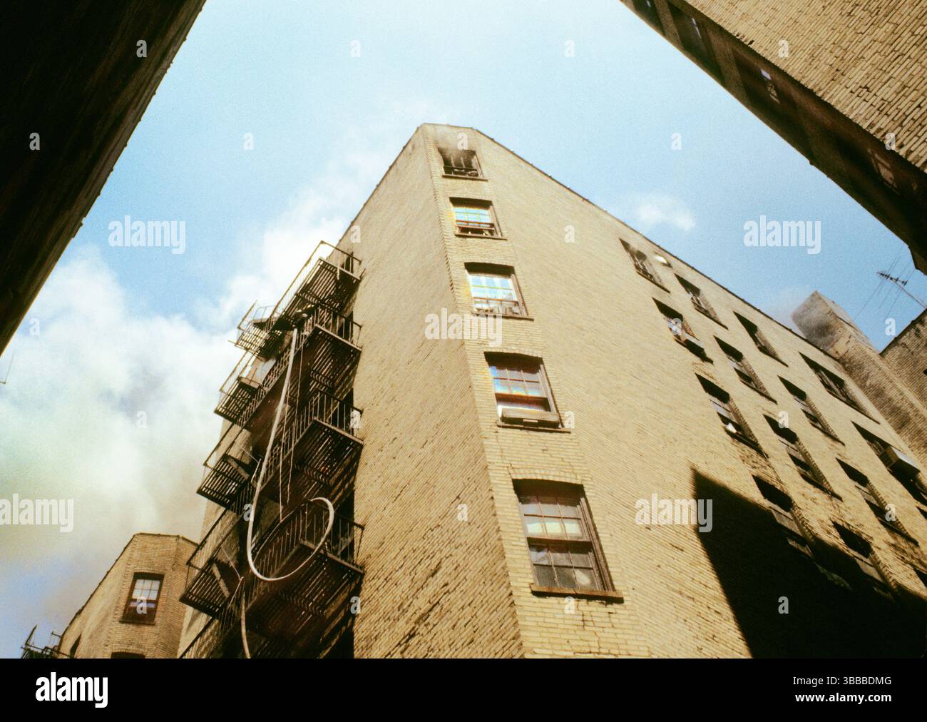 Fireman going up fire escape into New York burning building in The ...