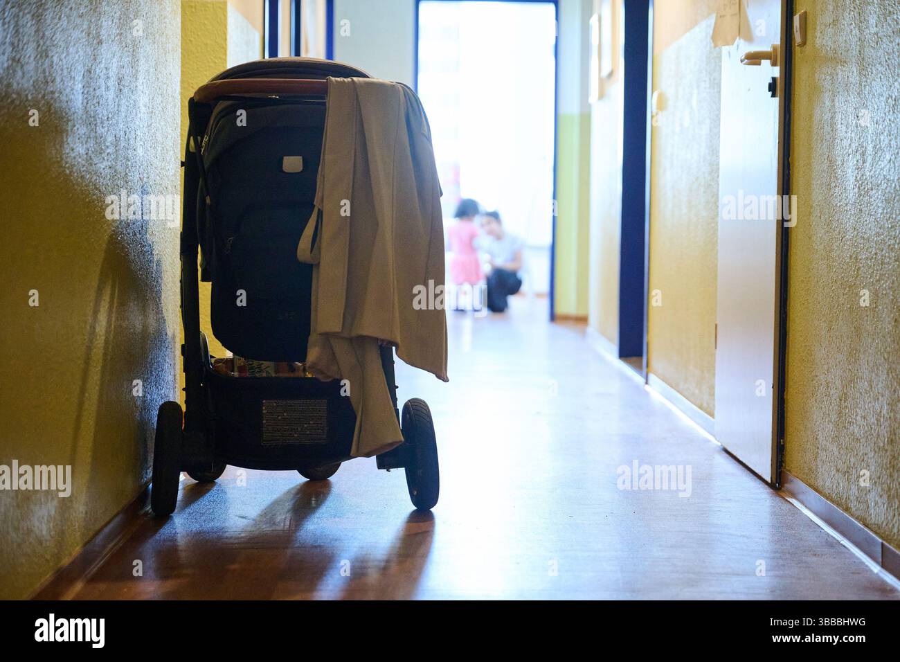 Germany. 13th May, 2025. A baby carriage stands in a corridor of a ...