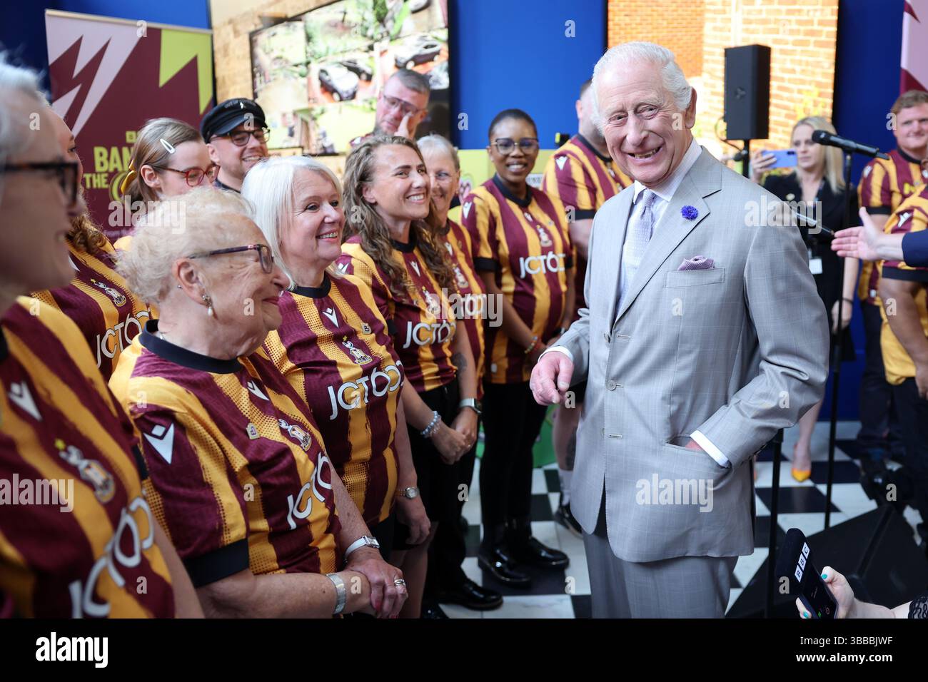 King Charles III meets members of the Bantam of the Opera choir, a ...