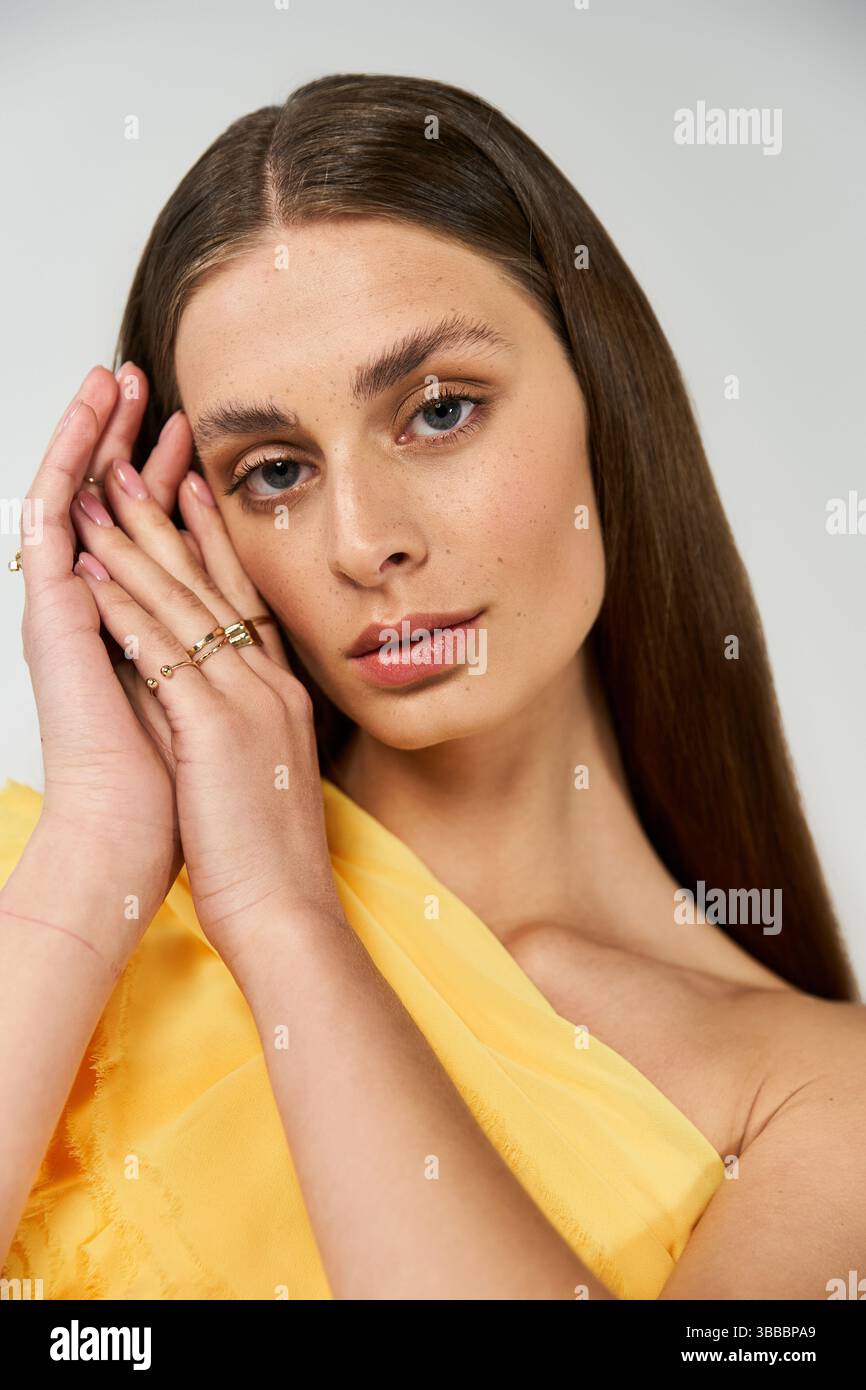 A stunning woman displays her beauty with soft poses and a radiant ...