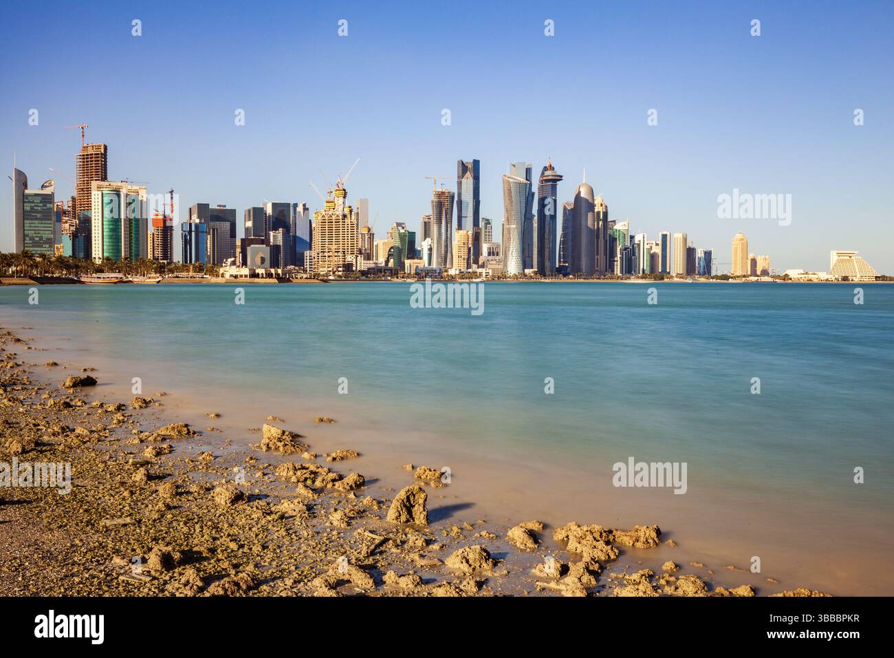 Evening view of the modern and high-rising city of Doha in Qatar ...
