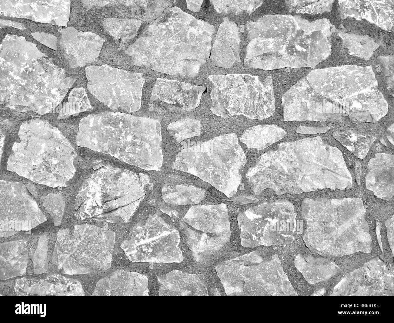 Black and white stone wall texture background Stock Photo - Alamy