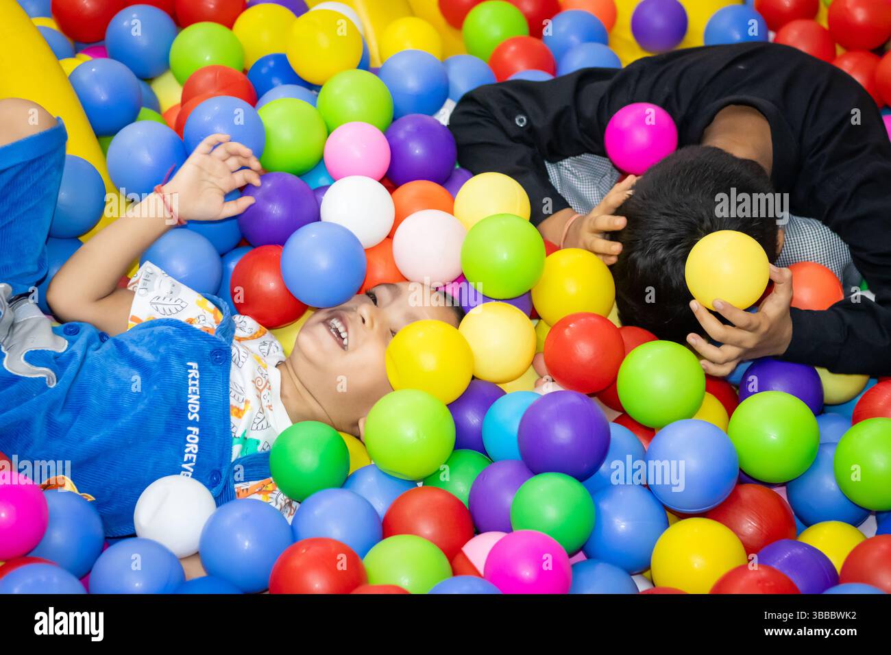 indian siblings enjoying at indoor kid play zone Stock Photo - Alamy