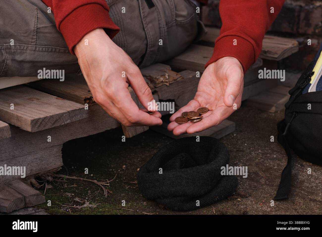 Homeless man counting coins outdoors, closeup view Stock Photo - Alamy