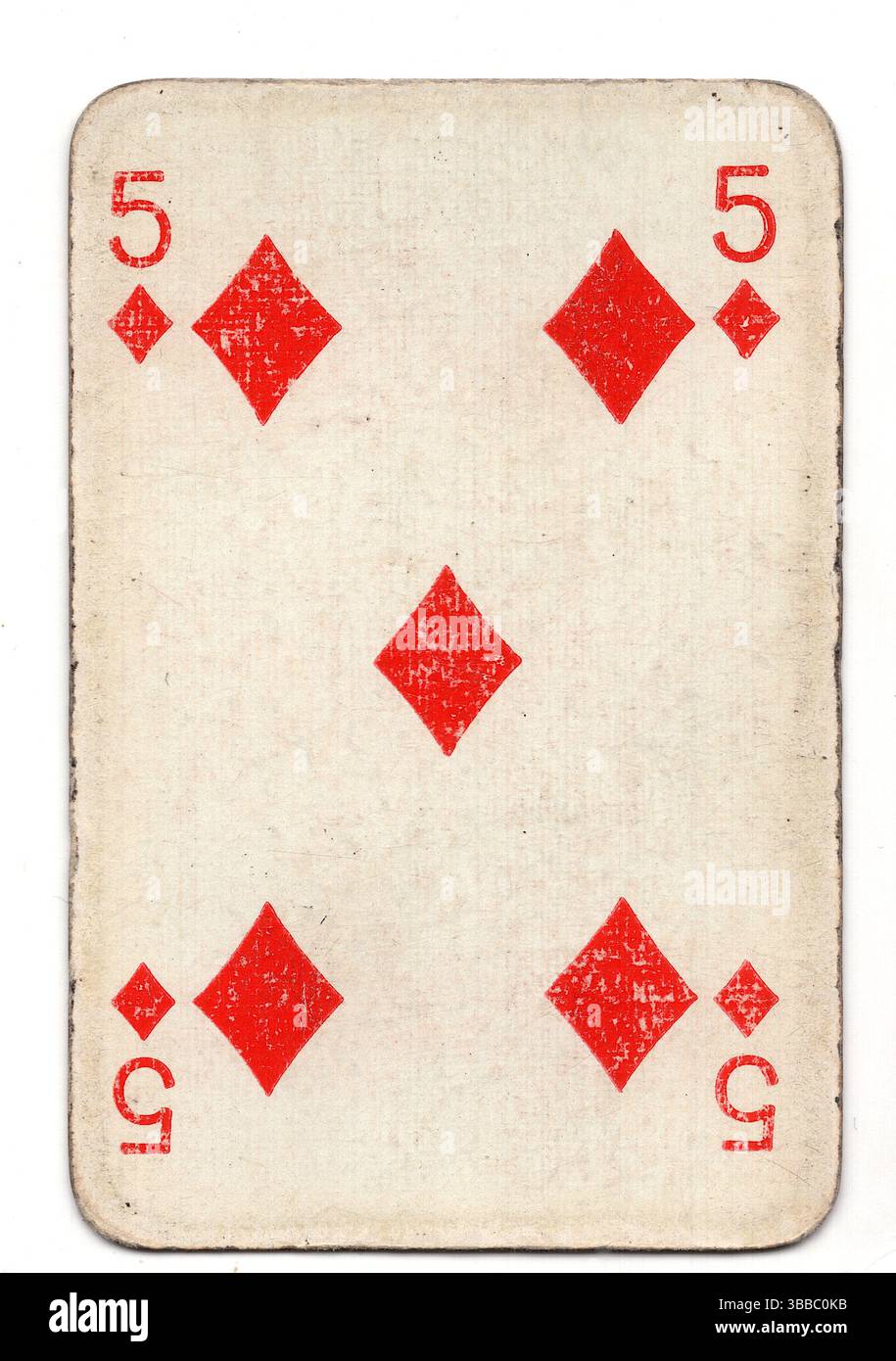 A vintage playing card in the suit of diamonds isolated on a white ...