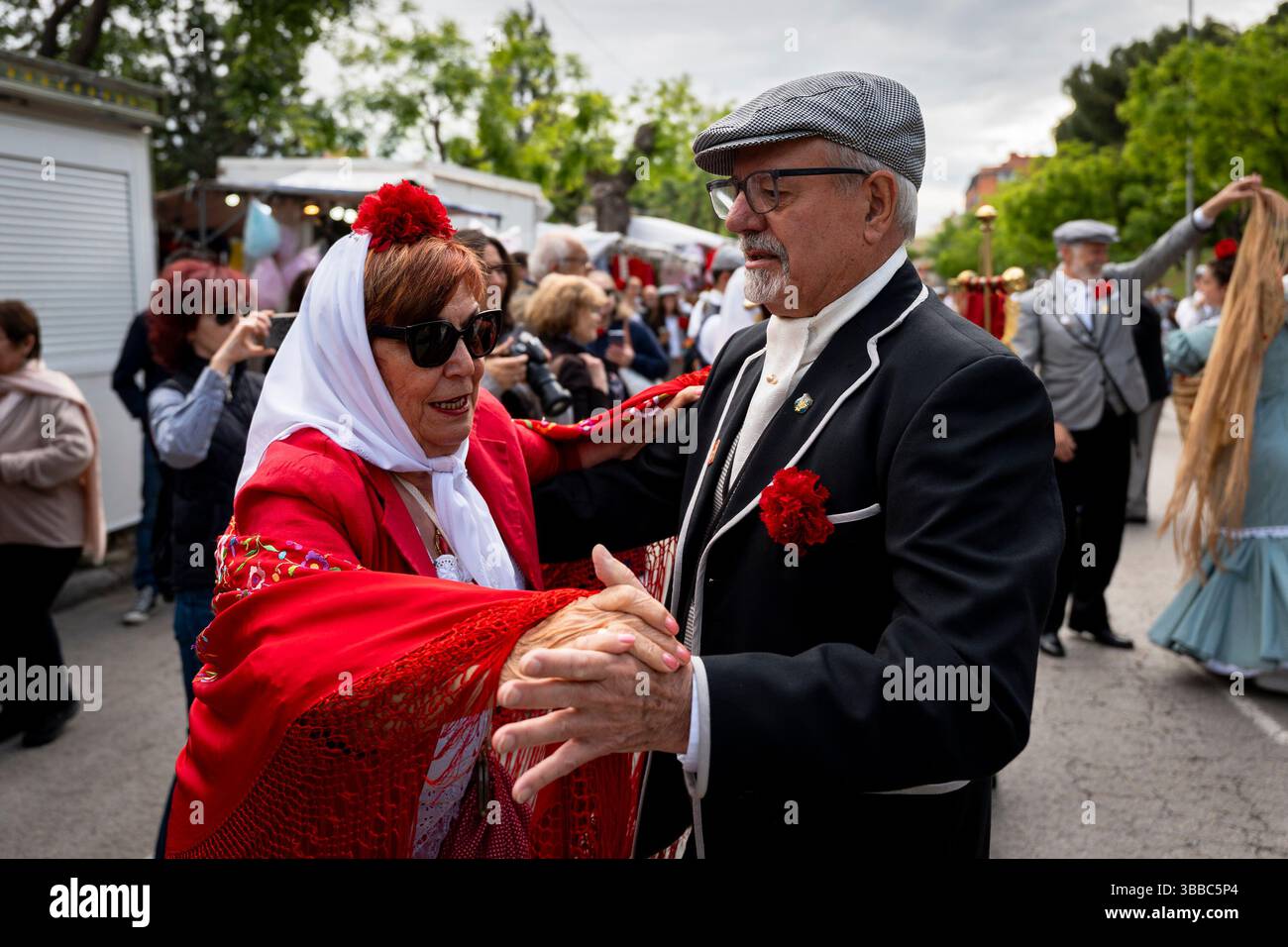 People wearing the traditional Madrid costumes known as ‘chulapo’ and ...
