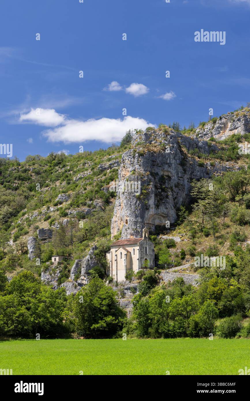 Saint Michel chapel built on a cliff face in Sauliac sur Cele, under a ...