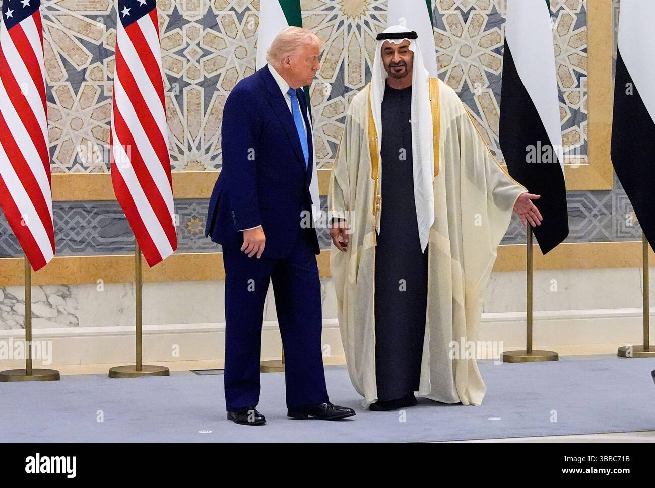 President Donald Trump walks with UAE President Mohammed bin Zayed Al ...