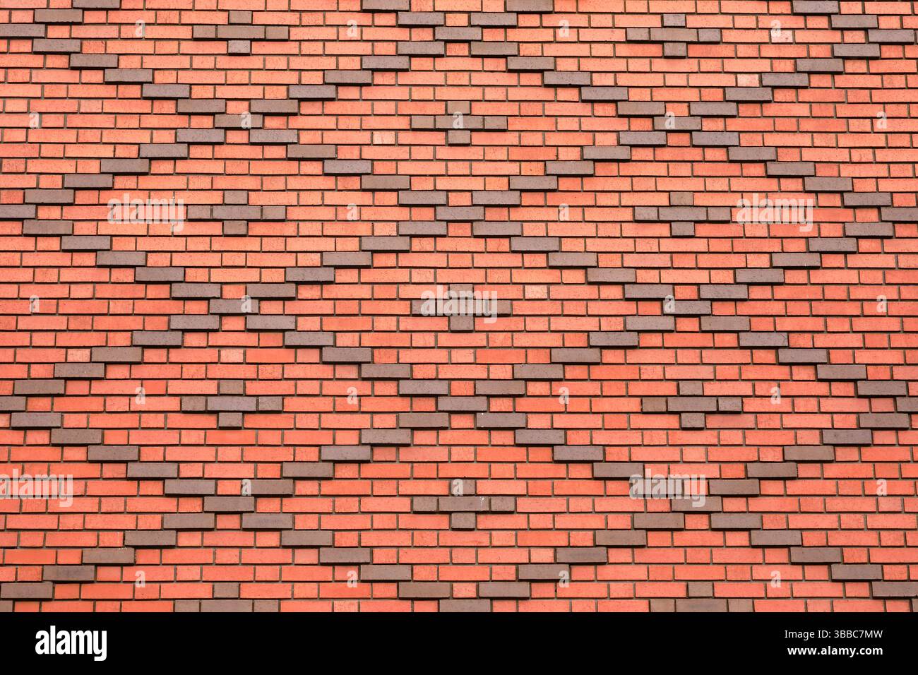a brick wall featuring a a dark brick diamond pattern Stock Photo - Alamy