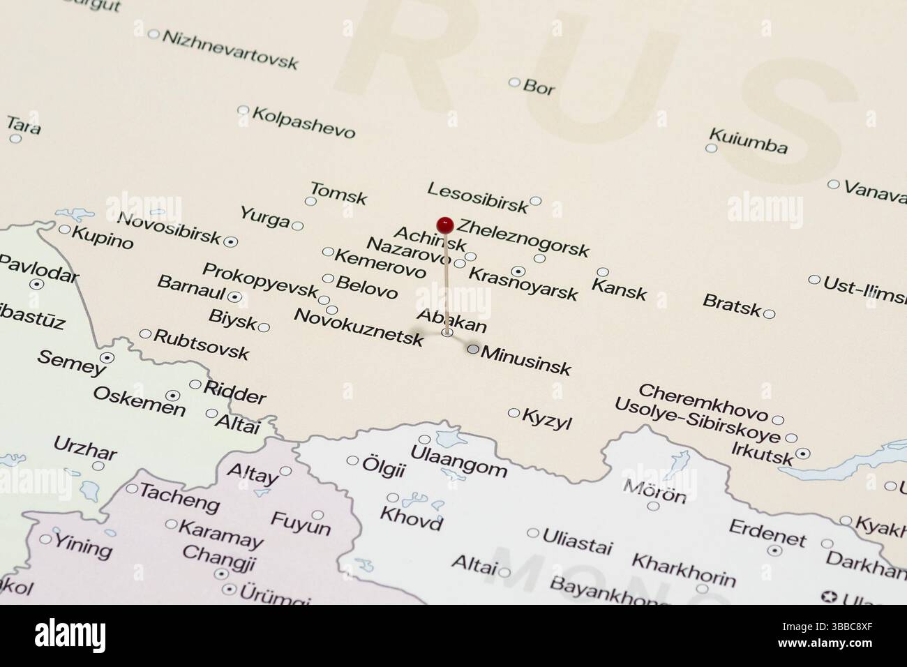 macro photo of a red pin needle into Abakan city of Russia political ...