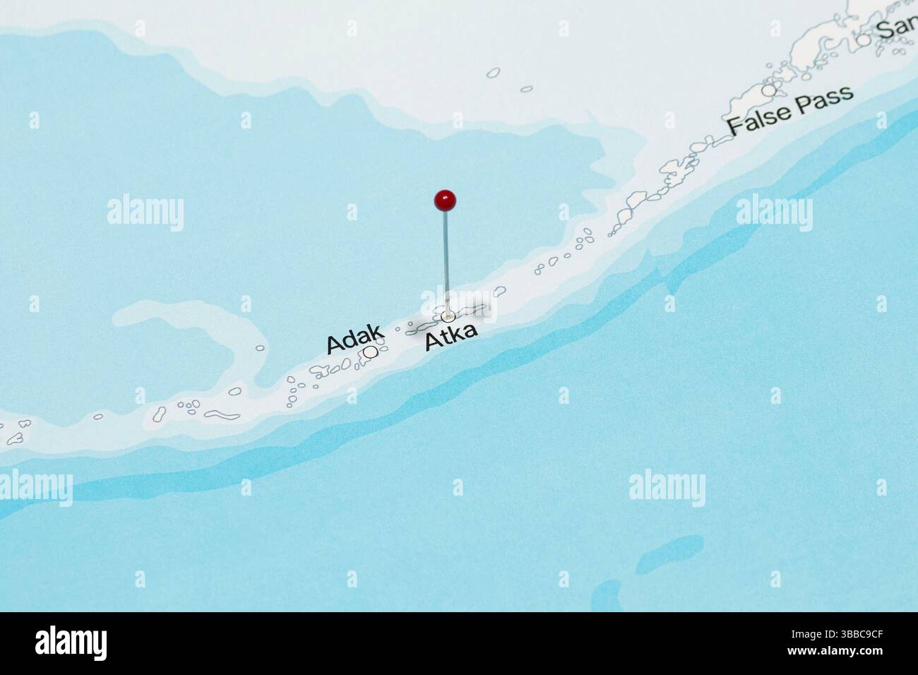 macro photo of a red pin needle into Atka city of Alaska territory of ...
