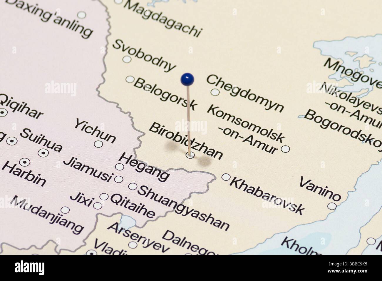 macro photo of a blue pin needle into birobidzhan city of Russia ...