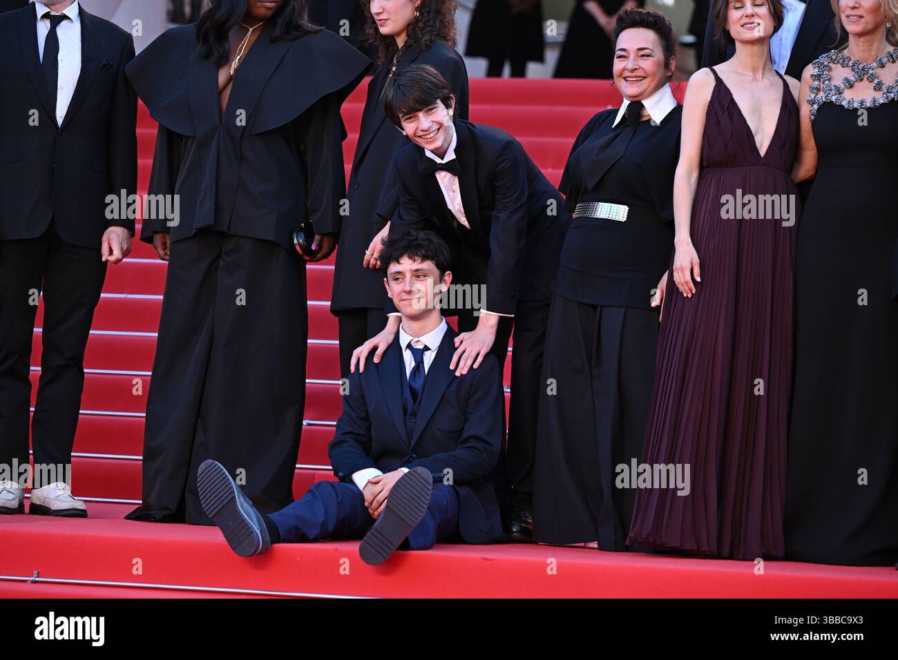 Come Peronnet (sitting) attend the premiere for Dossier 137 (Case 137 ...