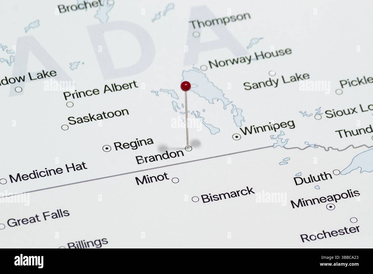 macro photo of a red pin needle into brandon city of Canada political ...
