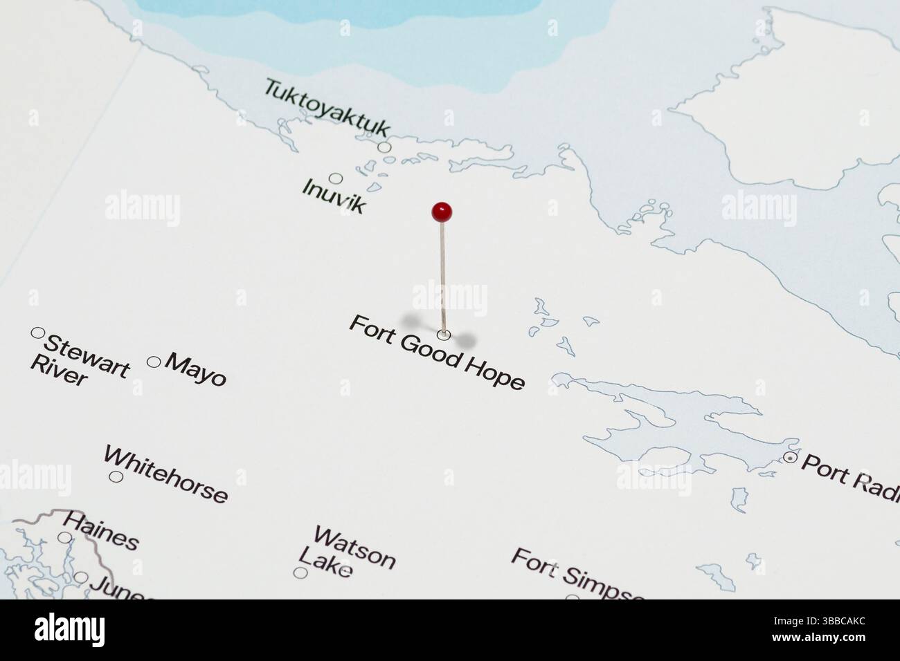 macro photo of a red pin needle into fort good hope city of Canada ...