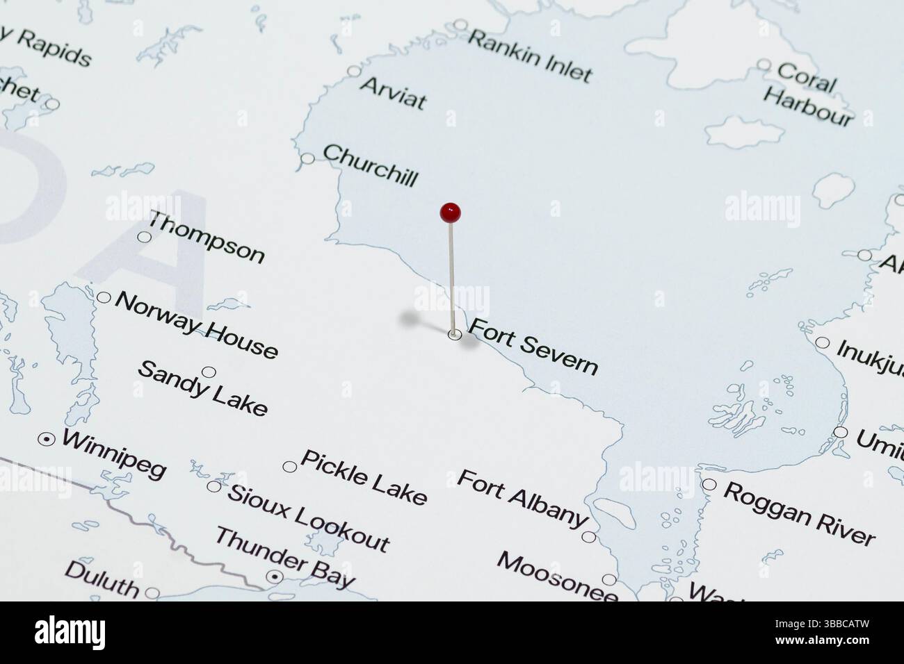 macro photo of a red pin needle into fort severn city of Canada ...