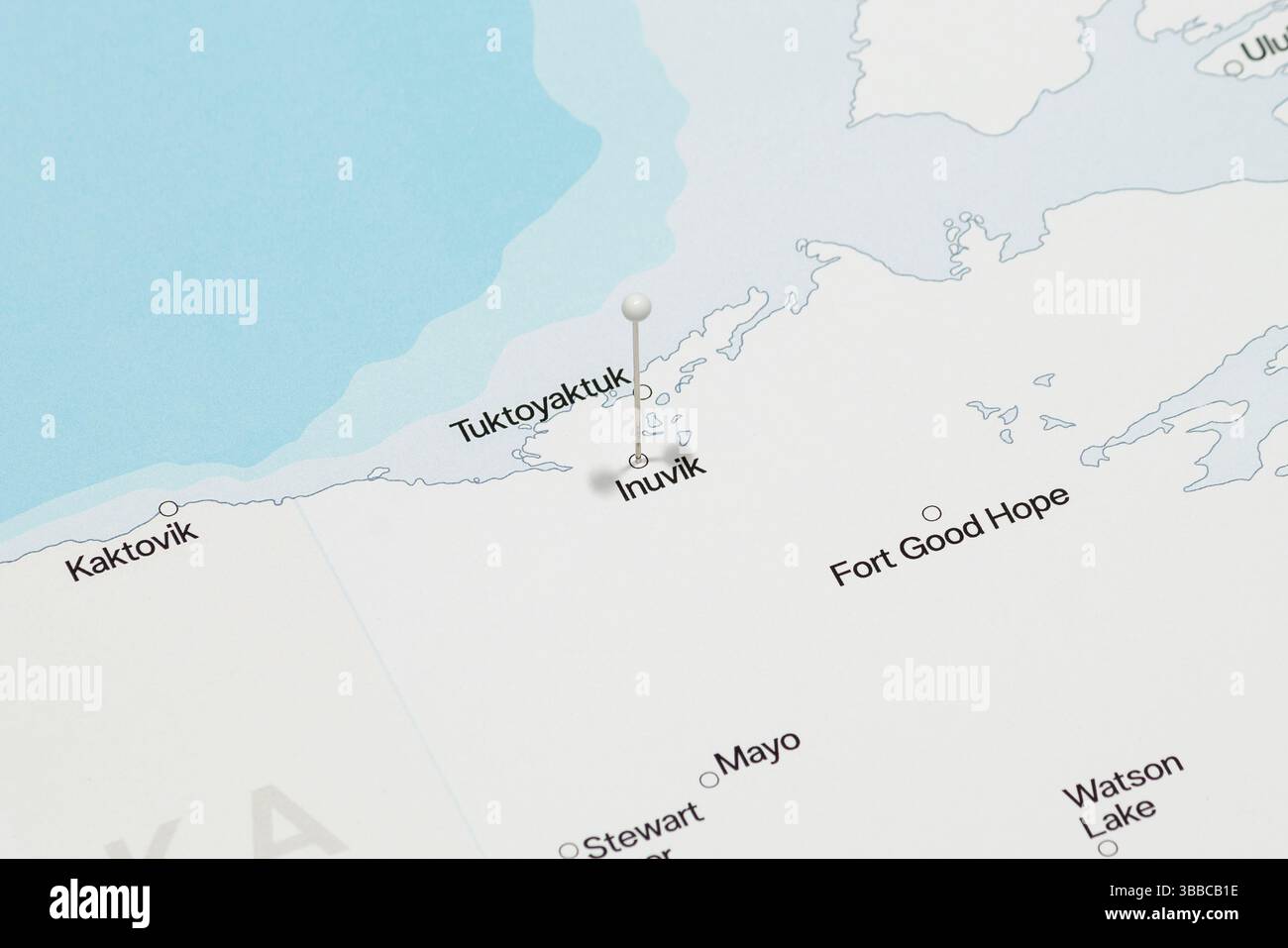 macro photo of a white pin needle into inuvik city of Canada political ...