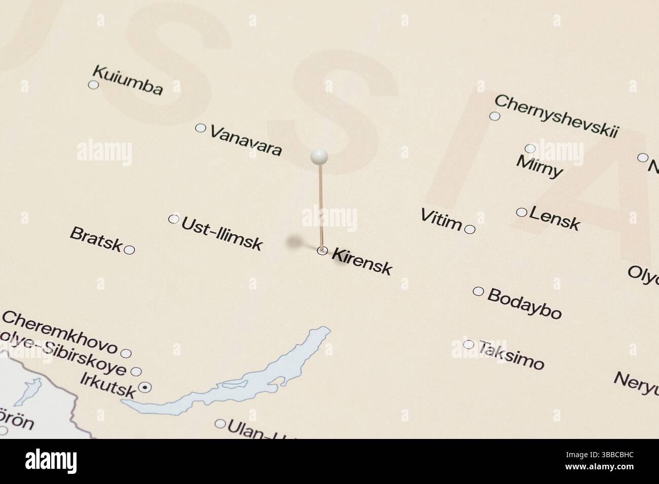 macro photo of a white pin needle into kirensk city of Russia political ...