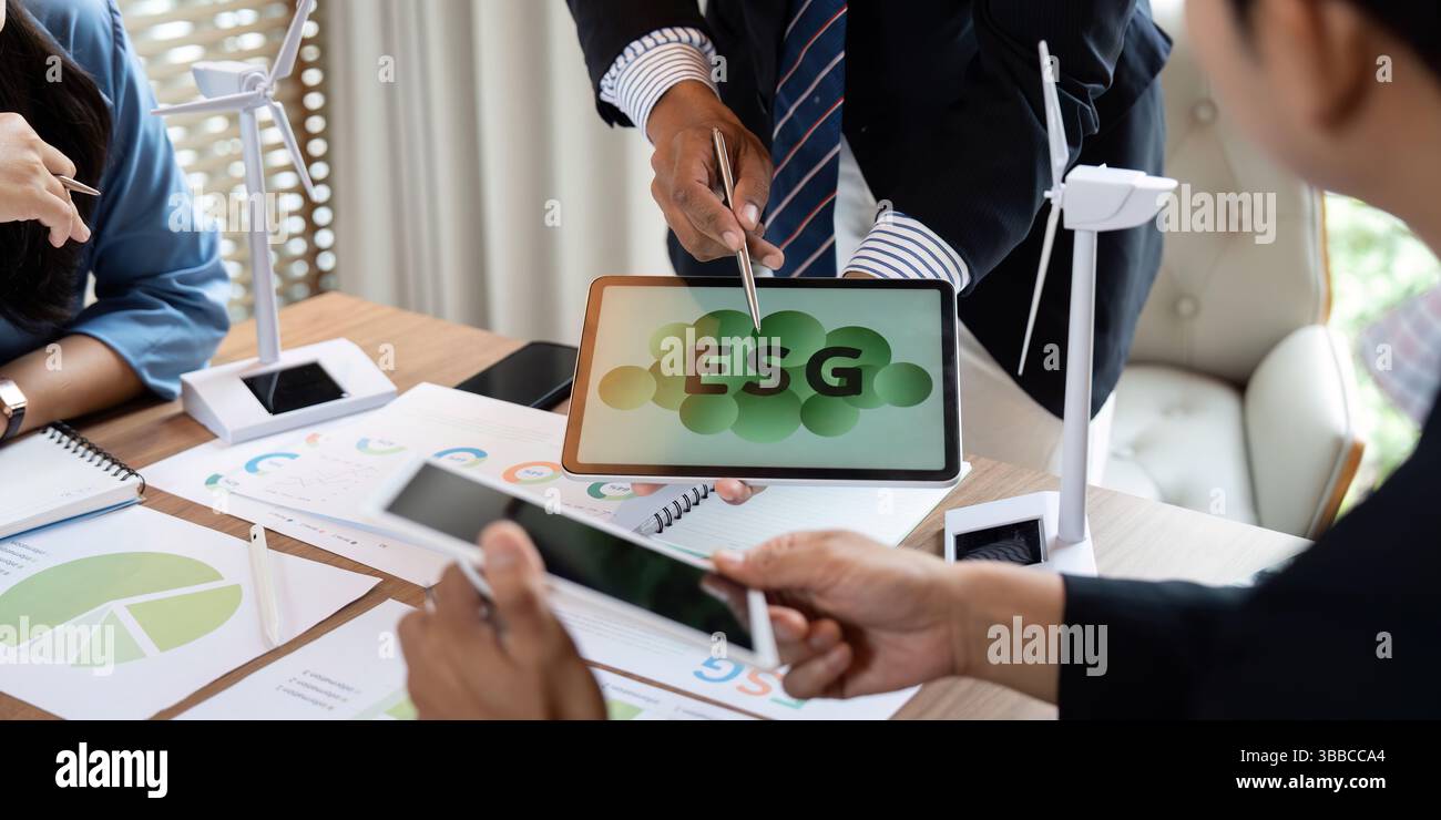 Sustainability and ESG. Professionals presenting ESG concepts on a ...
