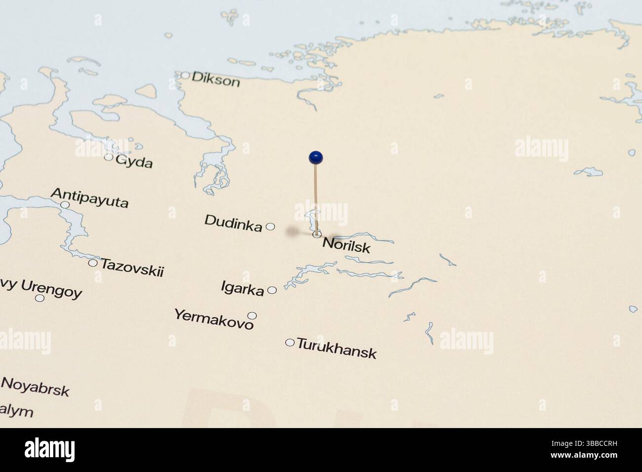 macro photo of a blue pin needle into norilsk city of Russia political ...