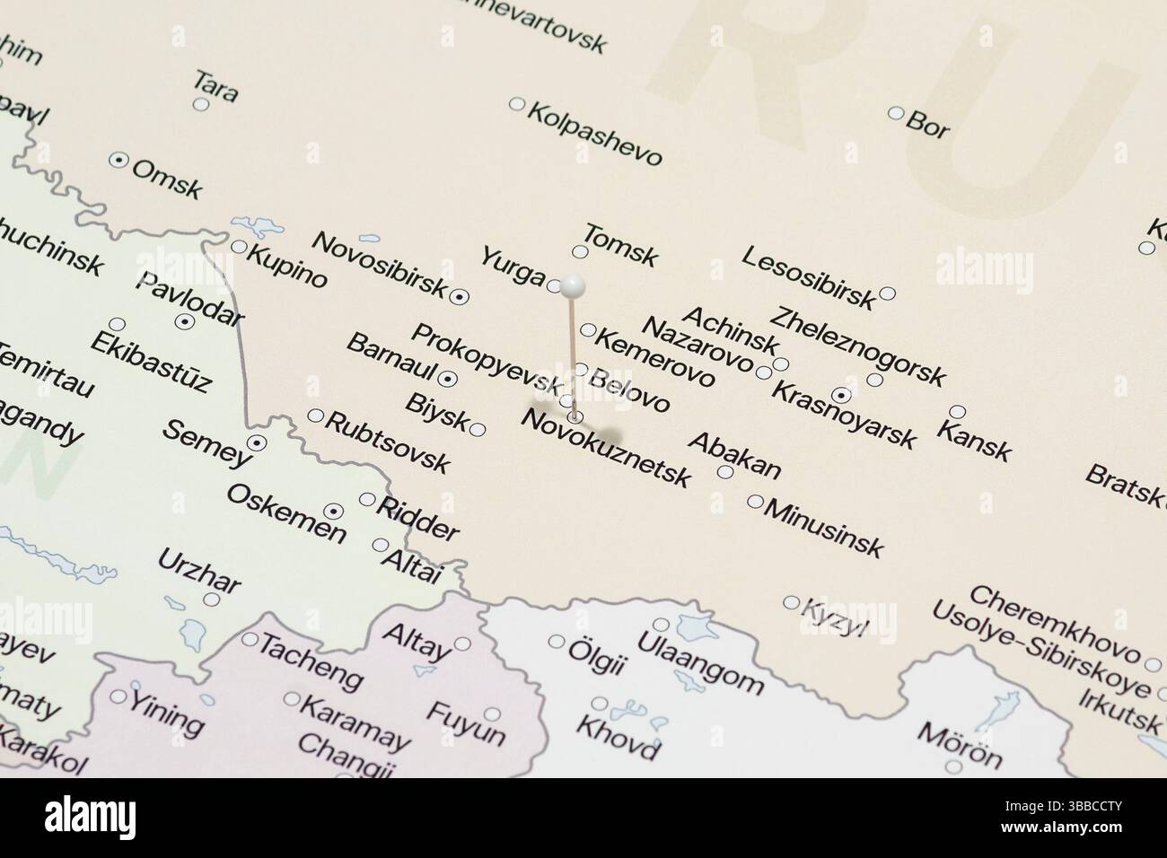 macro photo of a white pin needle into novokuznetsk city of Russia ...