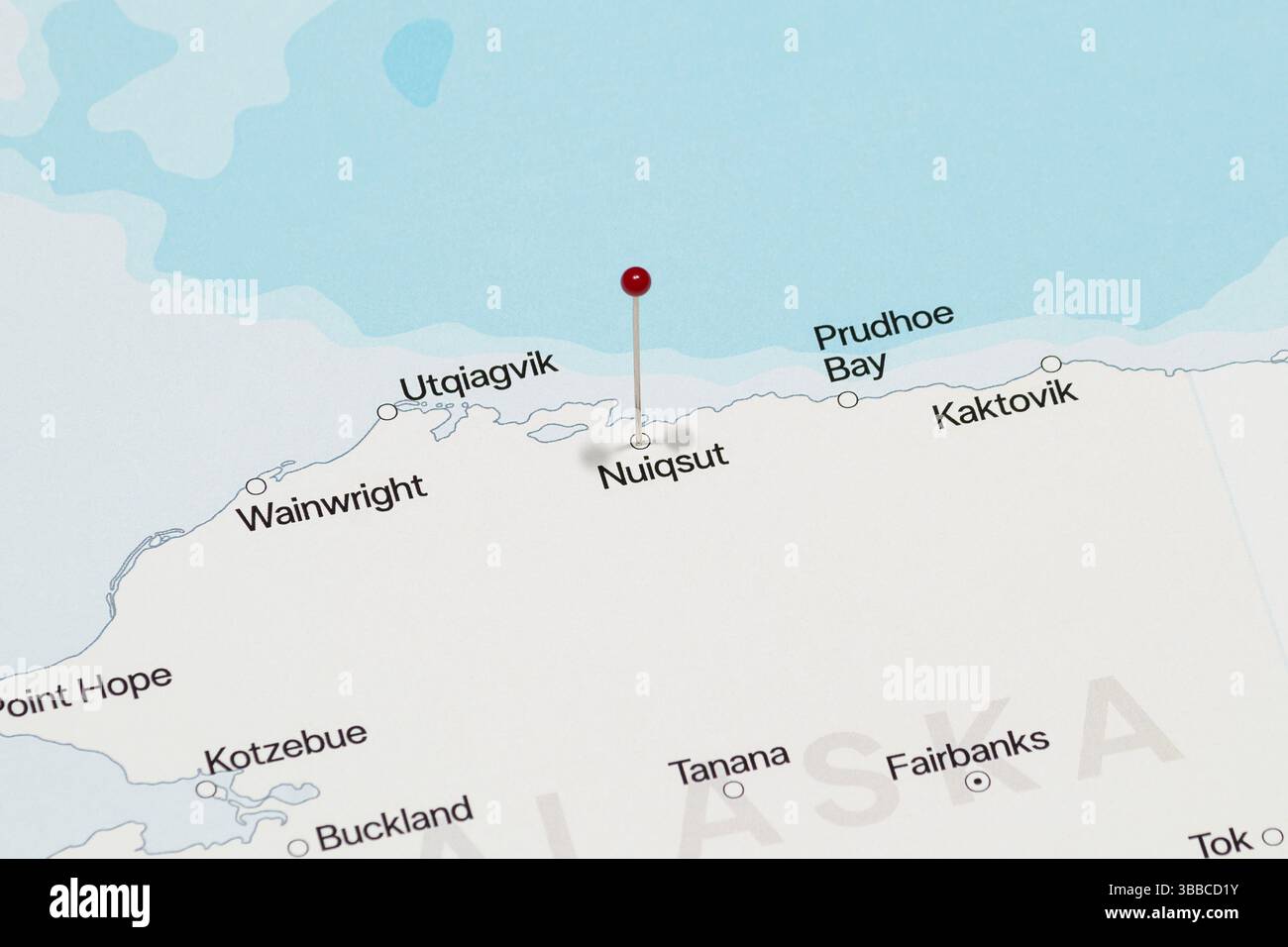 macro photo of a red pin needle into nuiqsut city of Alaska territory ...