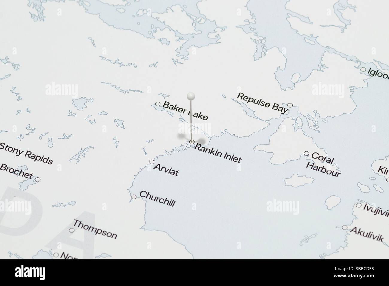 macro photo of a white pin needle into rankin inlet of Canada political ...