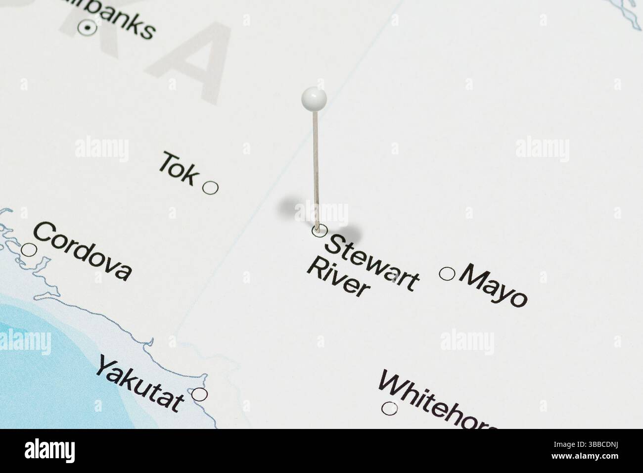 macro photo of a white pin needle into stewart river city of Canada ...