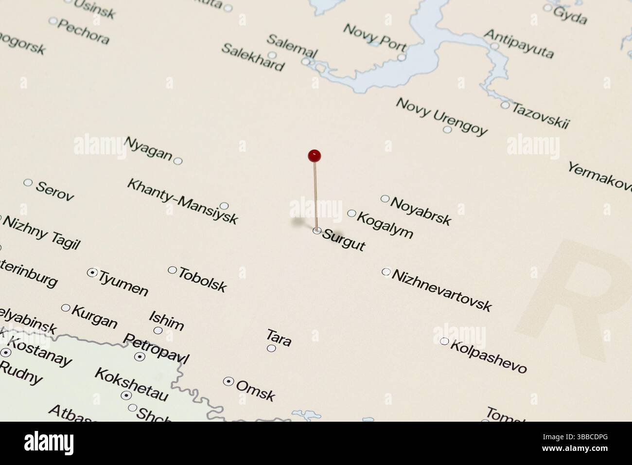 macro photo of a red pin needle into surgut city of Russia political ...