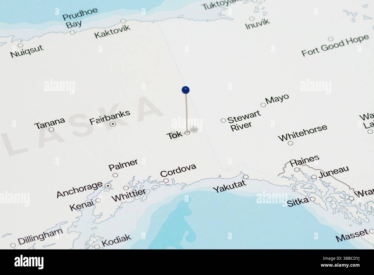 macro photo of a blue pin needle into tok city of Alaska territory of ...