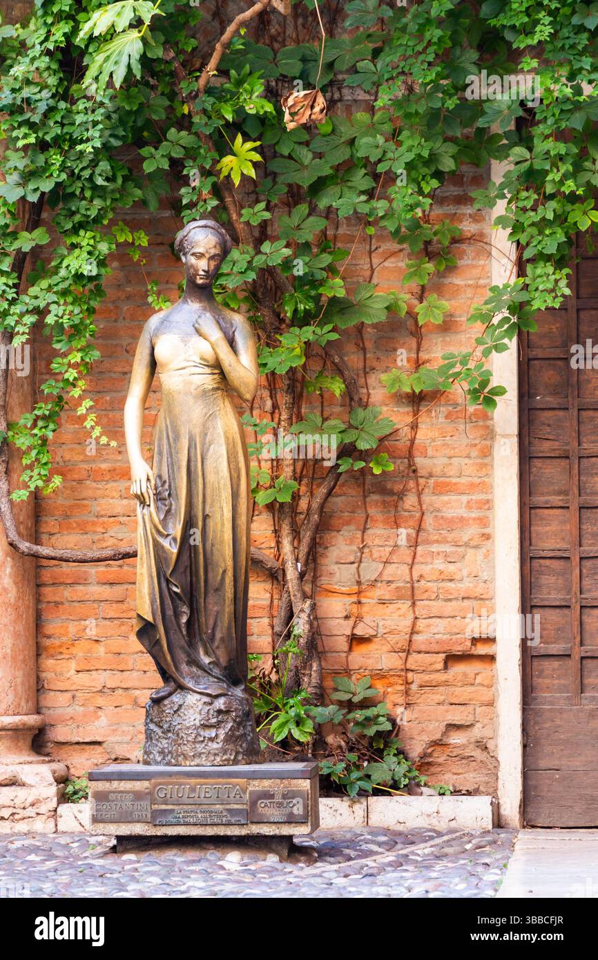 Verona, Italy - April 2025: Juliet statue in front of the Romeo and ...