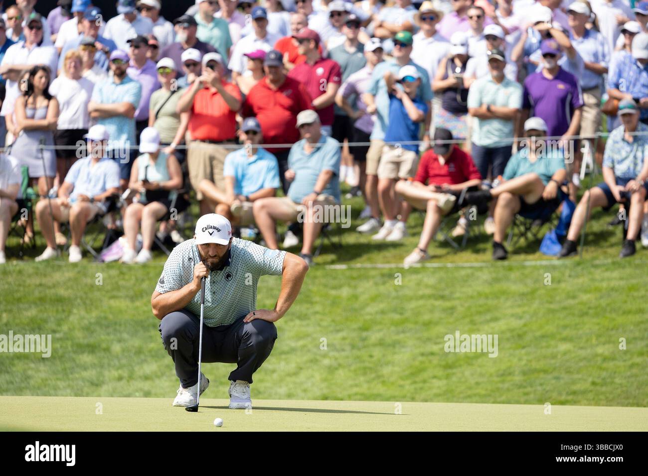 Captain Jon Rahm of Legion XIII reads his putt on the 18th green during ...