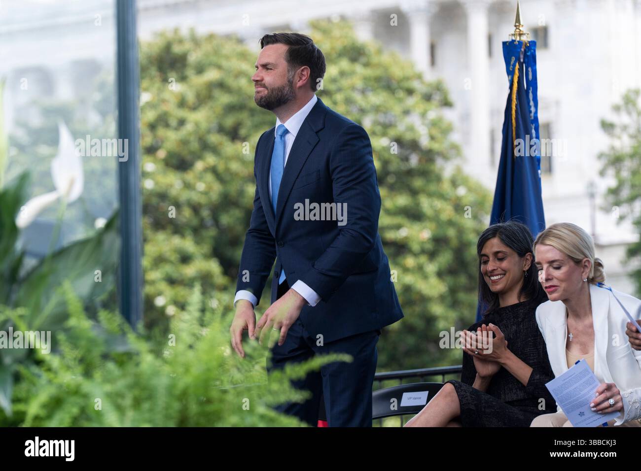 Vice President JD Vance, from left, walks to speak as second lady Usha ...