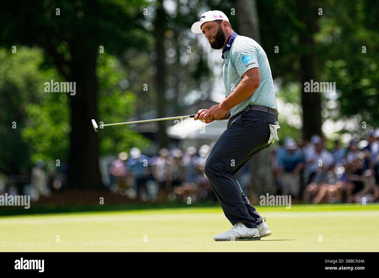 Jon Rahm, of Spain, reacts after missing a putt on the ninth hole ...