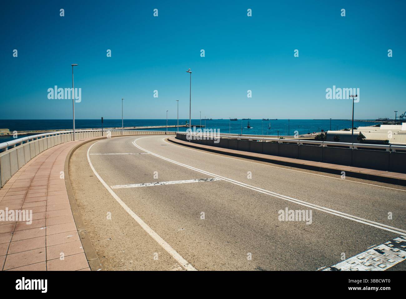 Empty freeway on sea background Stock Photo - Alamy
