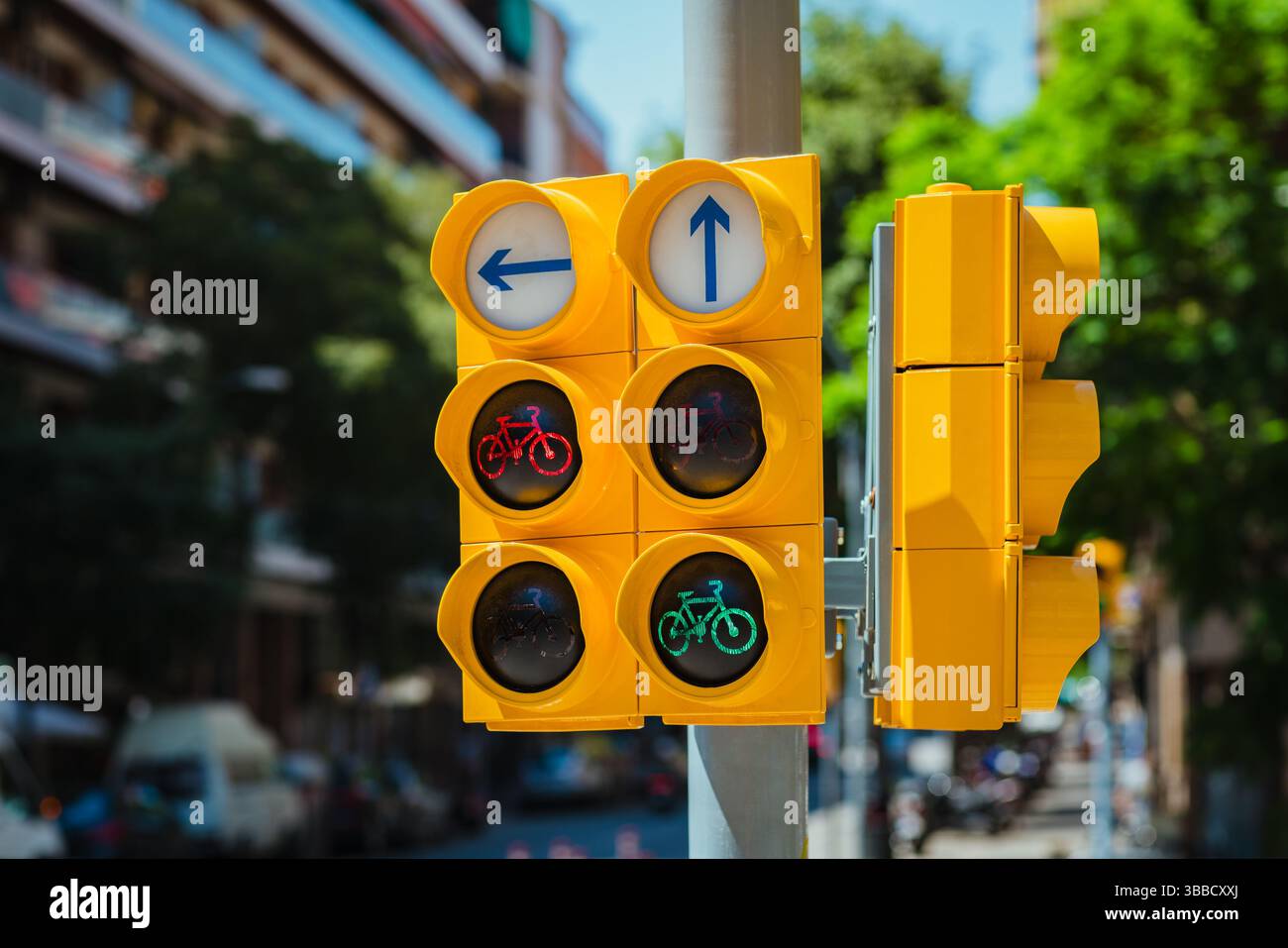 Yellow traffic light with arrows and bicycle traffic signal in Europe ...