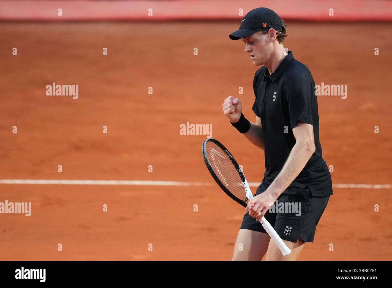 Italy's Jannik Sinner reacts after winning a point to Norway's Casper Ruud, during their ...