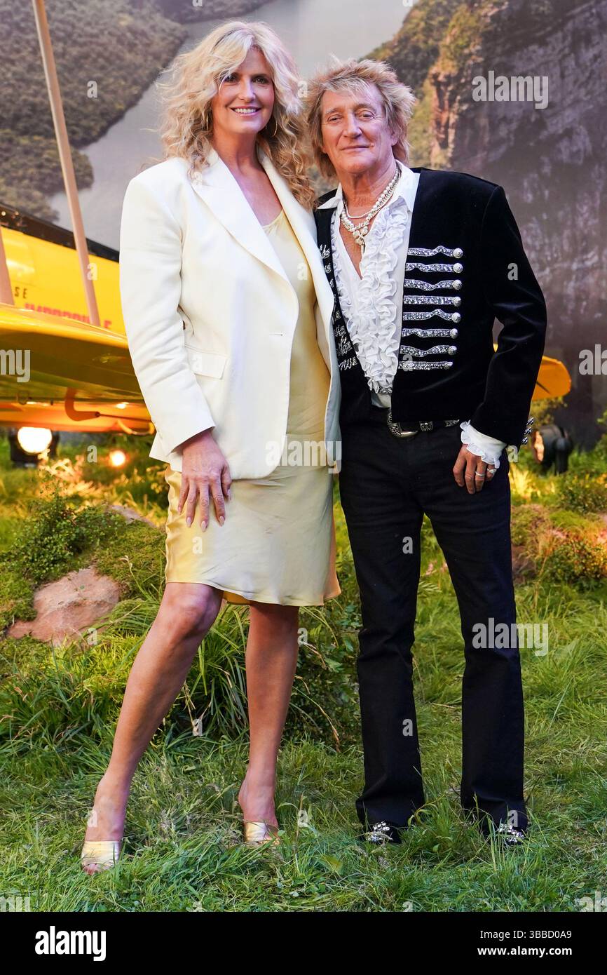 Penny Lancaster, left, and Rod Stewart pose for photographers upon ...