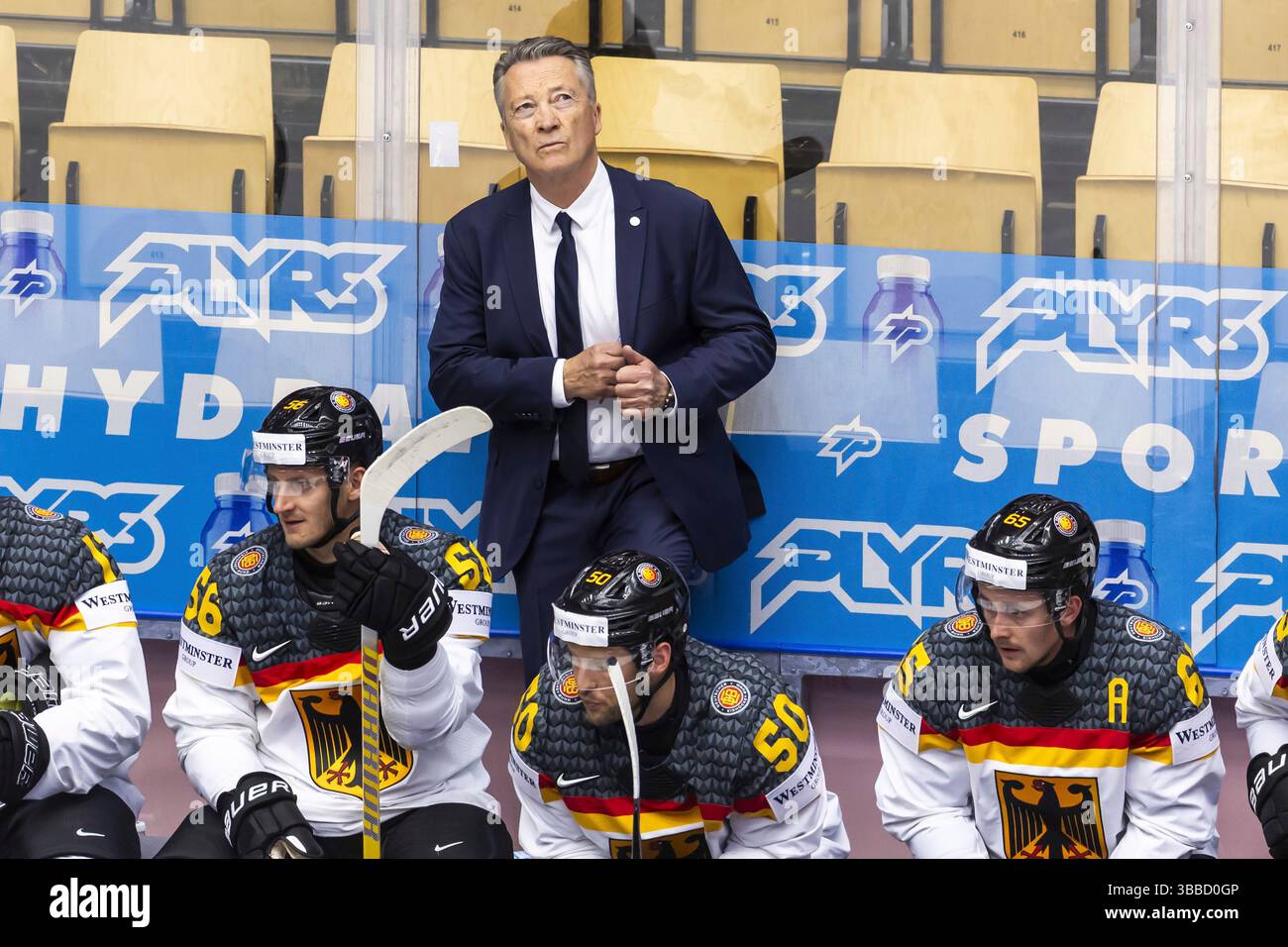 Germany's head coach Harold Kreis, rear, follows the IIHF 2025 World ...